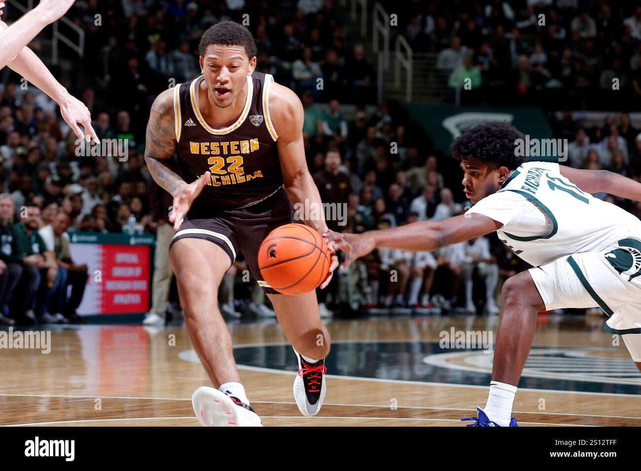Michigan State guard Jase Richardson, right, reaches in against Western ...