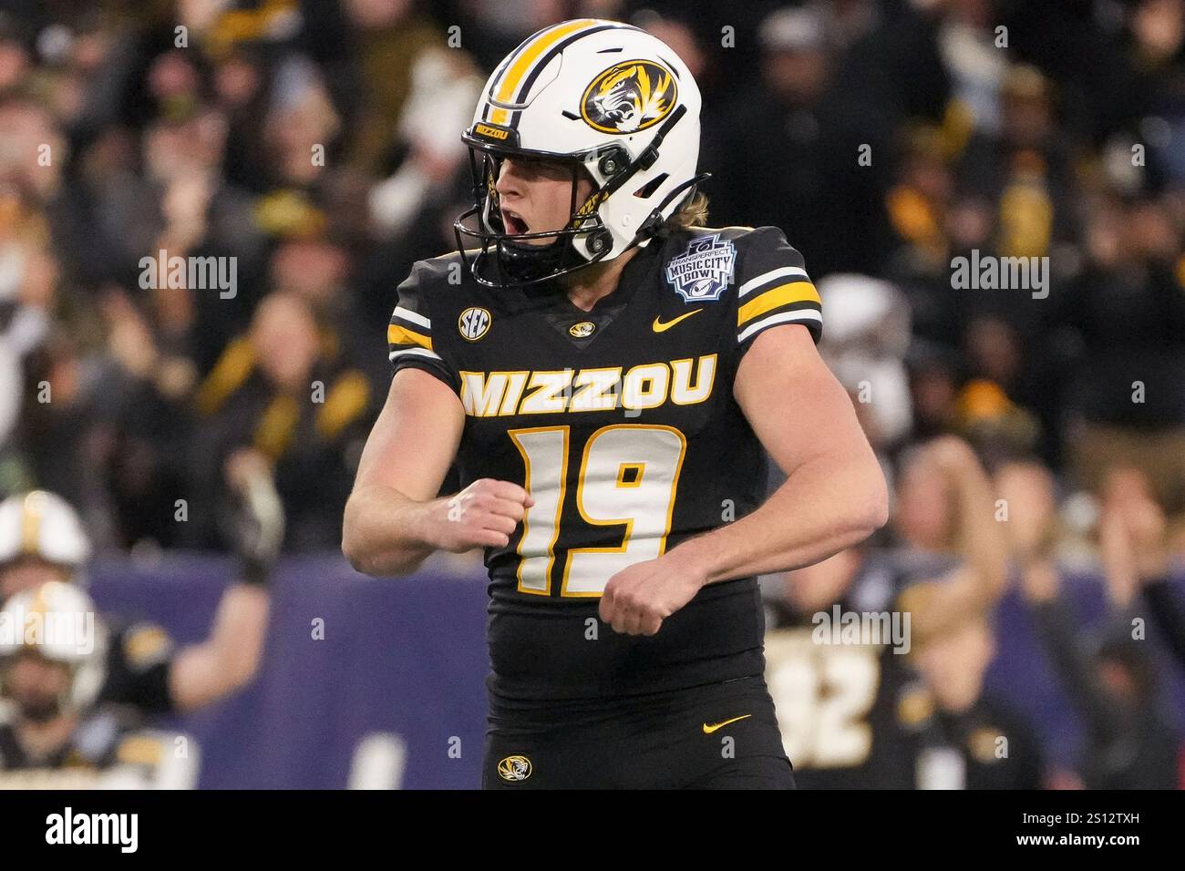 Missouri place-kicker Blake Craig (19) celebrates a 56 yard field goal ...