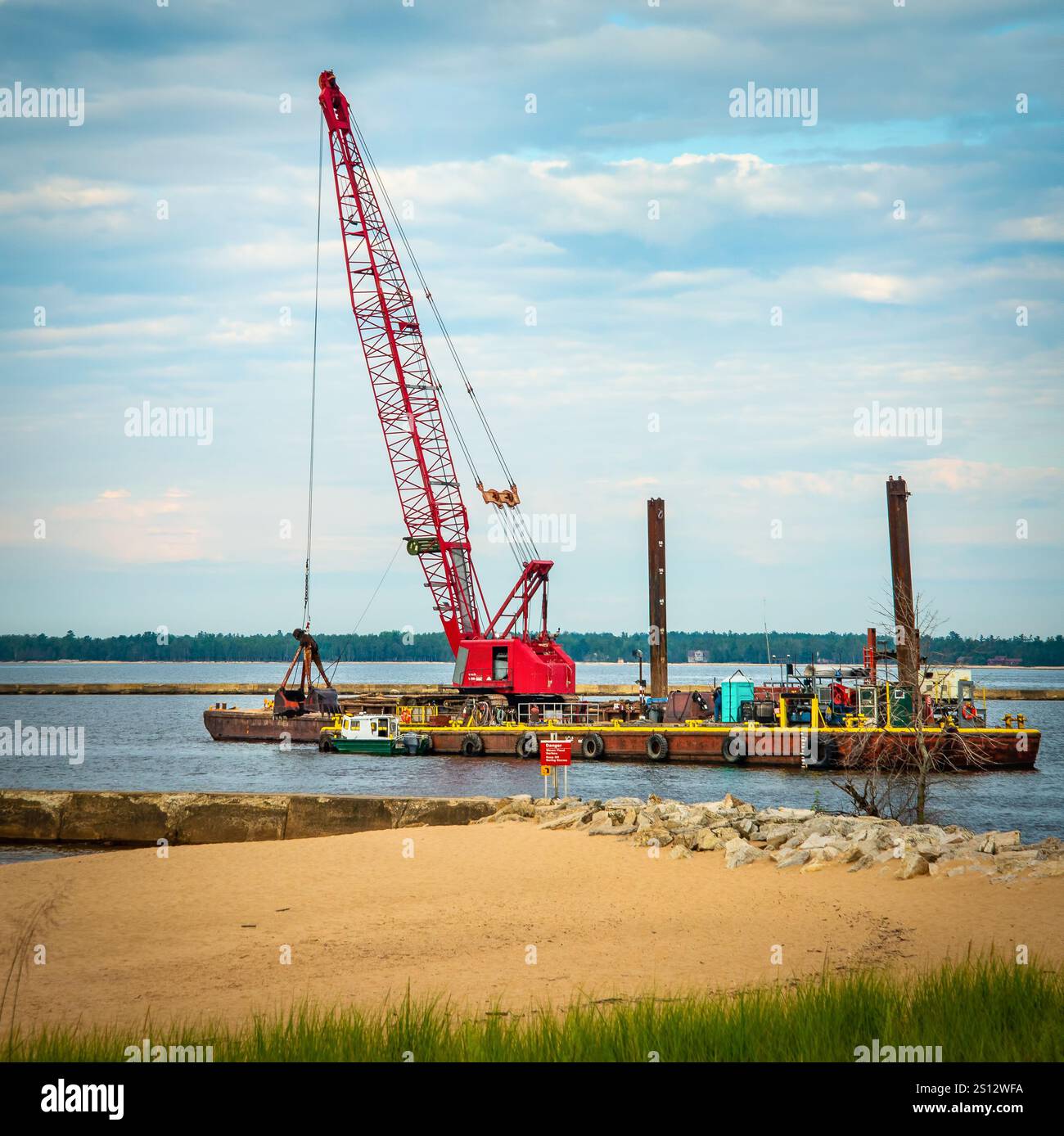Dredge crane on barge in Lake Michigan shoreline Stock Photo - Alamy