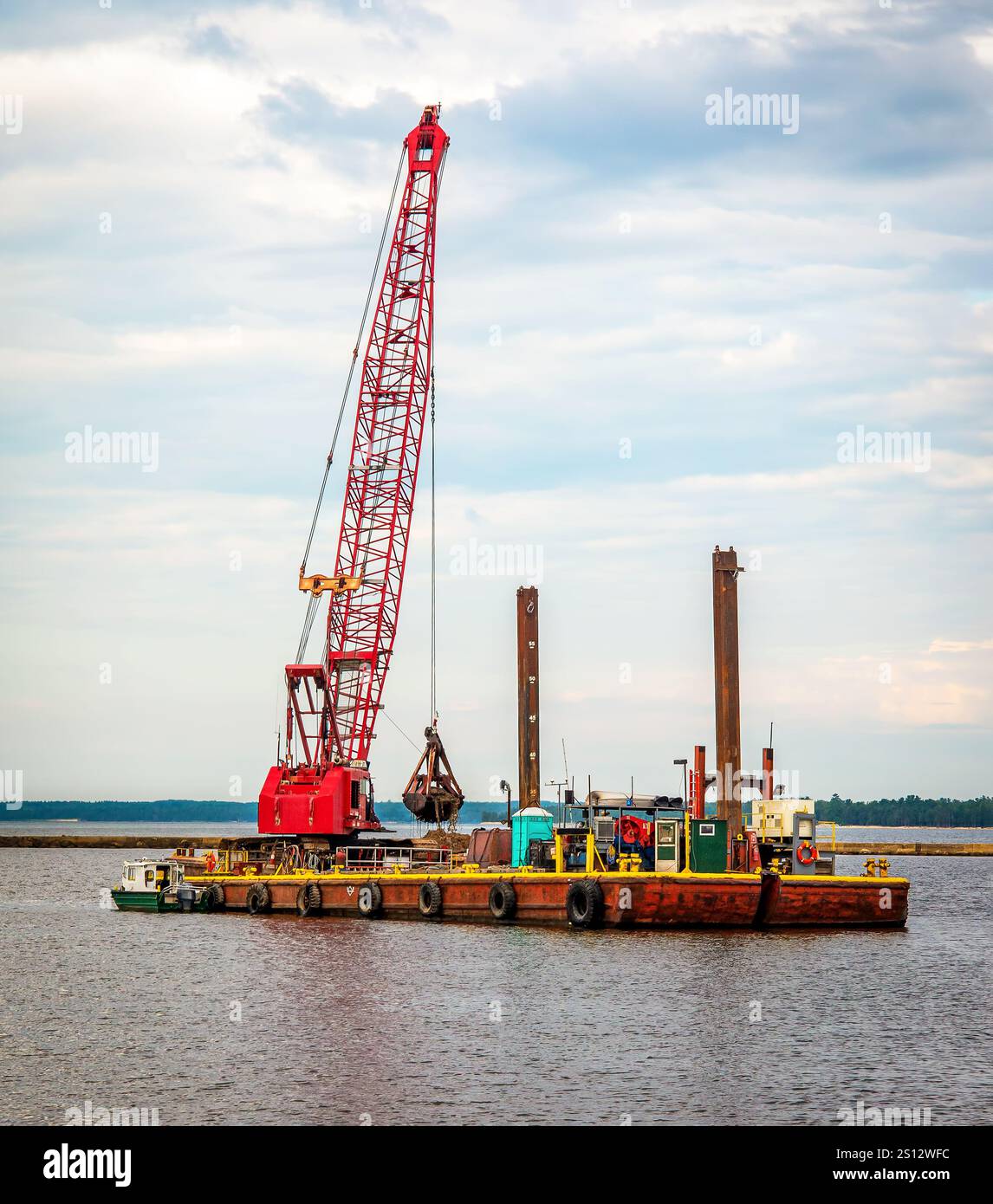 Dredge crane on barge in Lake Michigan shoreline Stock Photo - Alamy