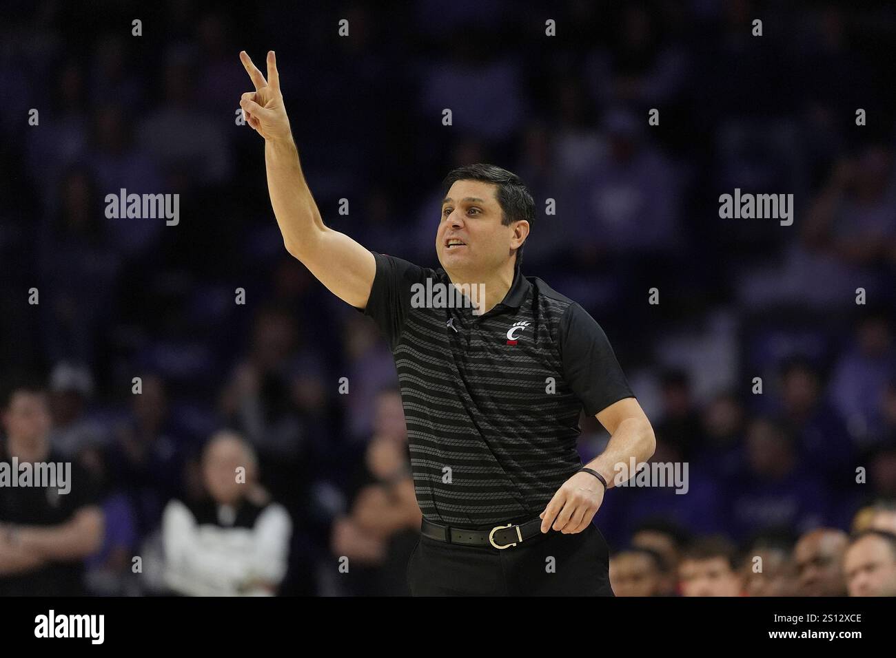 Cincinnati head coach Wes Miller motions to his players during the ...