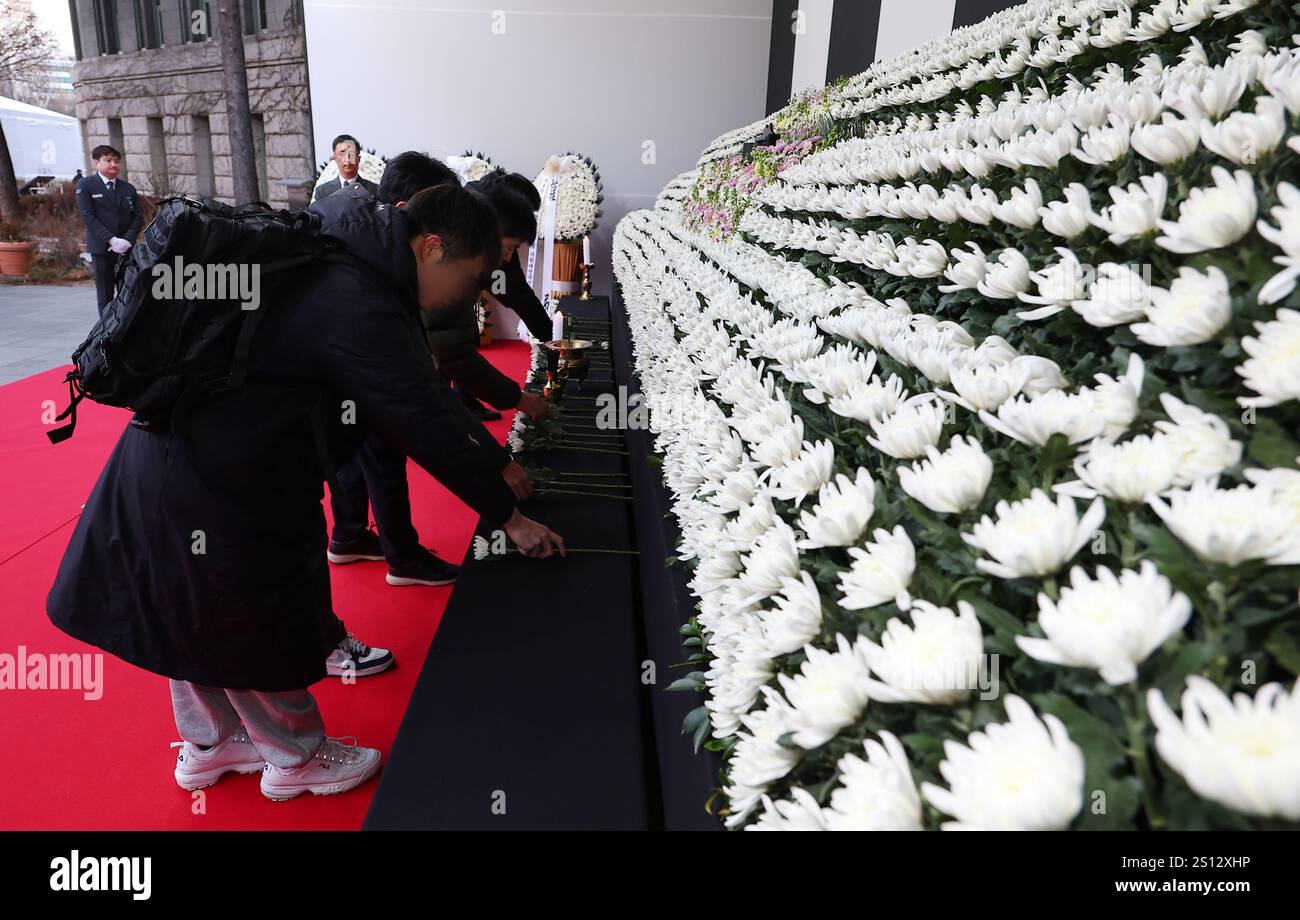 31st Dec, 2024. Memorial altar in Seoul Mourners lay flowers at a memorial altar in front of ...