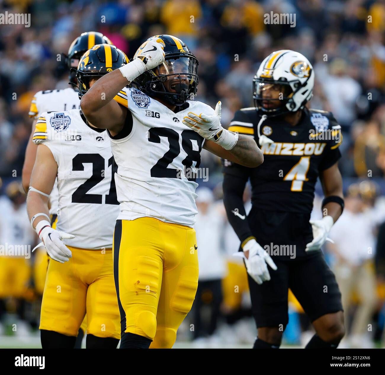 December 30, 2024: Iowa Hawkeyes RB #28 Kamari Moulton motions to the ...