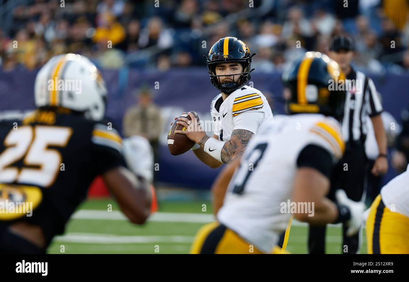 Nashville, TN, USA. 30th Dec, 2024. Iowa Hawkeyes QB #1 Brendan ...