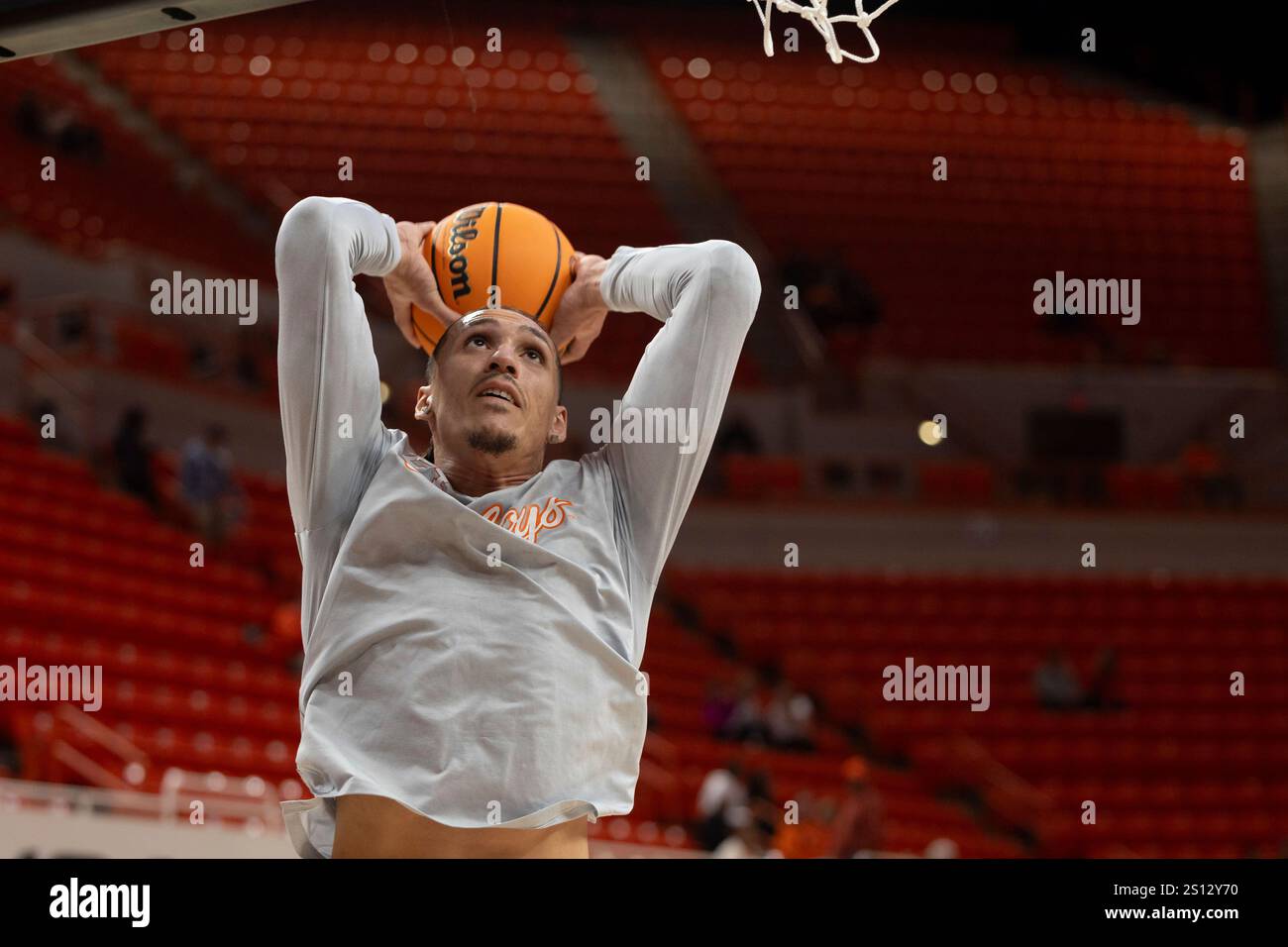 Oklahoma State forward Patrick Suemnick goes up to slam-dunk before an ...