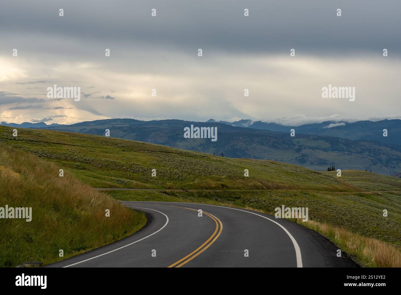 Grand Loop Road Curves Left Below Mount Washburn In Yellowstone ...