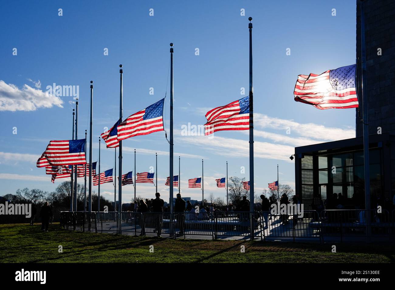 Flags fly at half mast in Washington to honor the passing of President Jimmy Carter. James Earl ...
