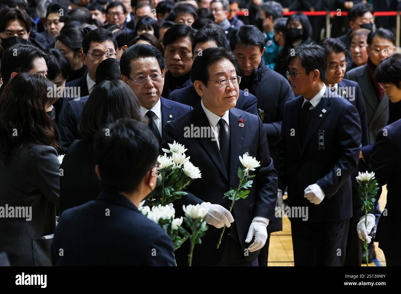 Seoul, South Korea. 30th Dec, 2024. Lee Jae-myung (C), leader of South Korea's Democratic Party ...