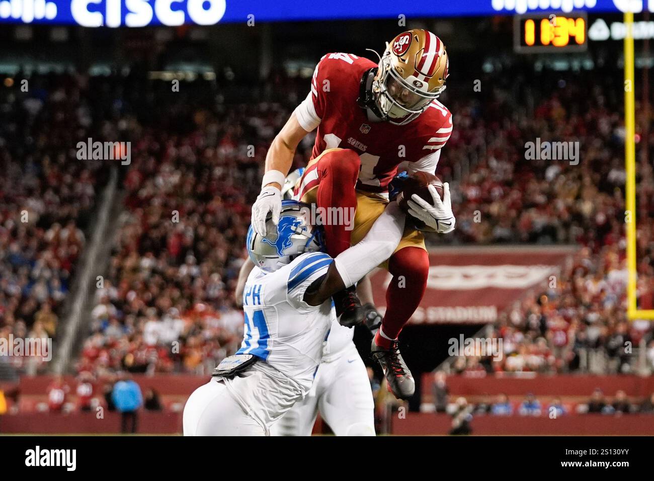 San Francisco 49ers wide receiver Ricky Pearsall, top, leaps over ...
