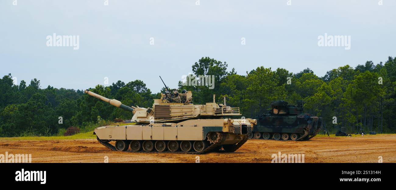 An Abrams tank positions itself on the field during a live fire ...