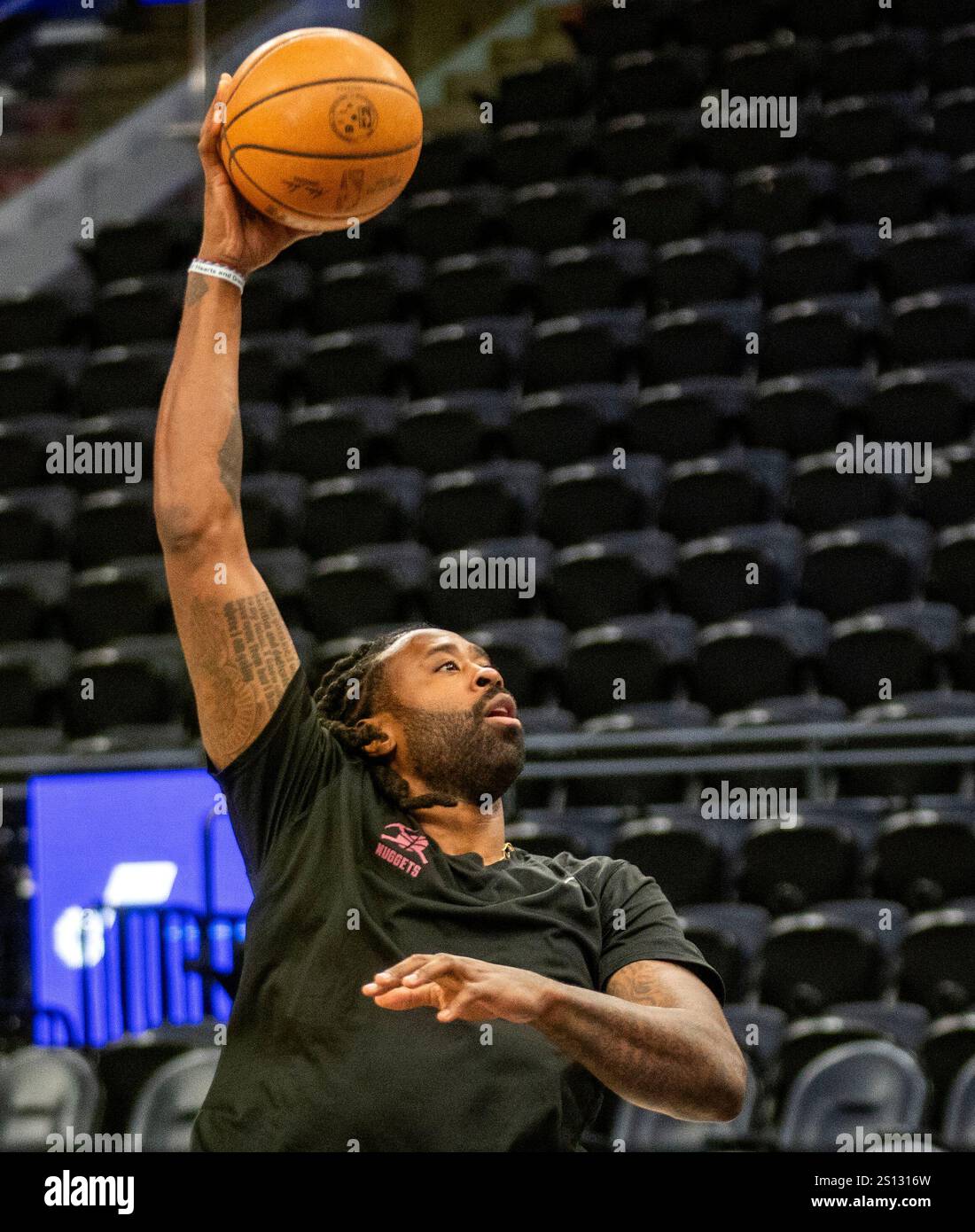 Denver Nuggets center DeAndre Jordan warms up before an NBA basketball ...