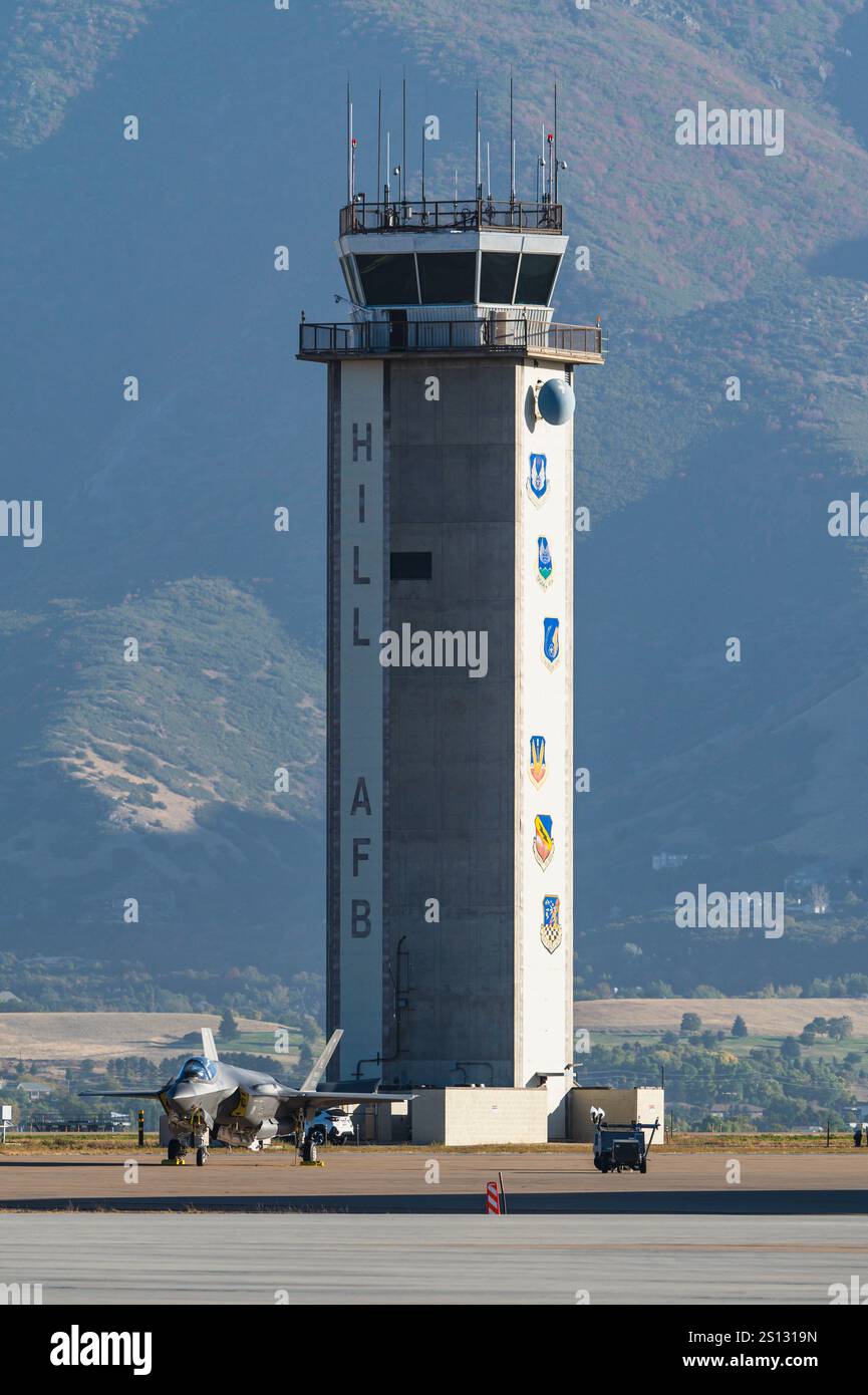 The air traffic control tower is seen across the flightline at Hill Air ...