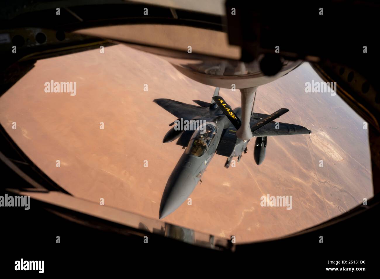 A U.S. Air Force F-15E Strike Eagle is refueled over the U.S. Central ...
