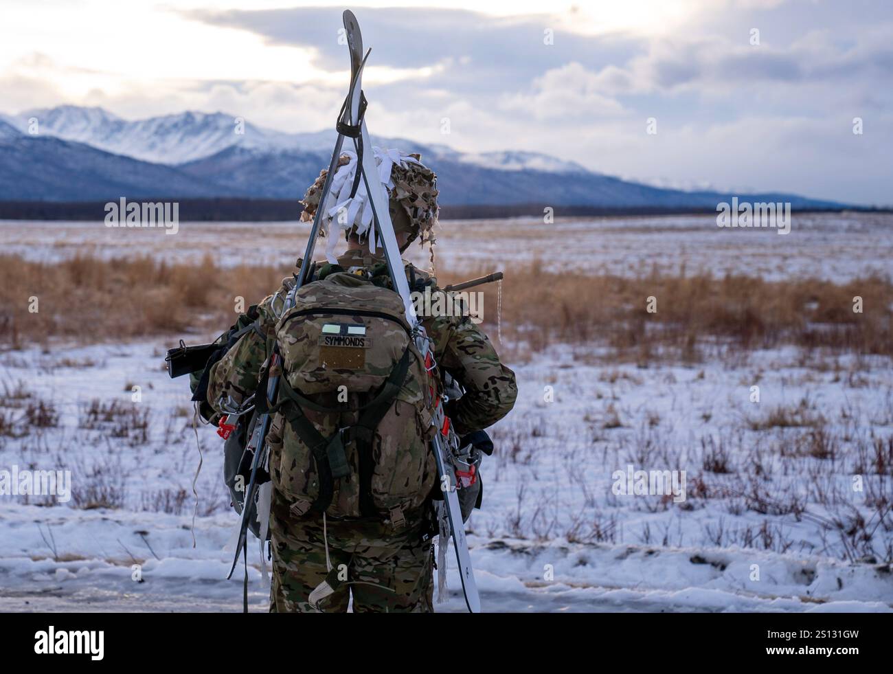2nd Infantry Brigade, 11th Airborne Division Soldier looking over ...