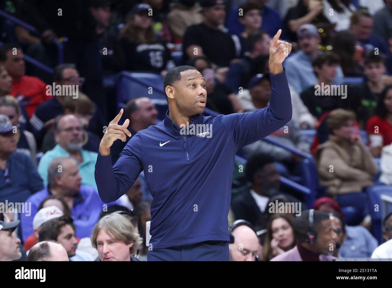 New Orleans Pelicans head coach Willie Green signals to his players in ...