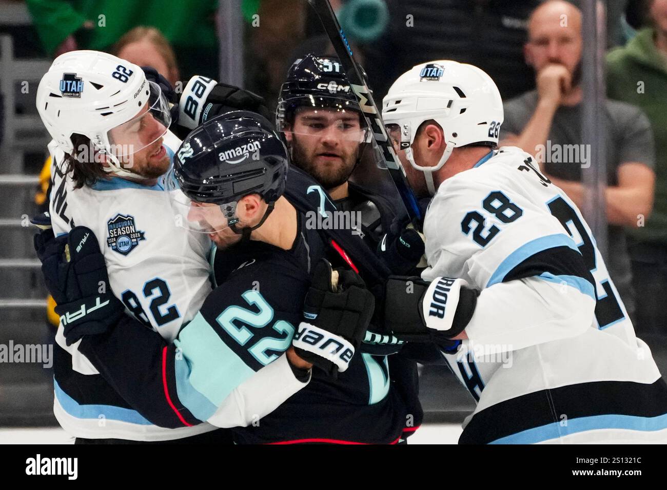 Utah Hockey Club center Kevin Stenlund (82) and defenseman Ian Cole (28 ...