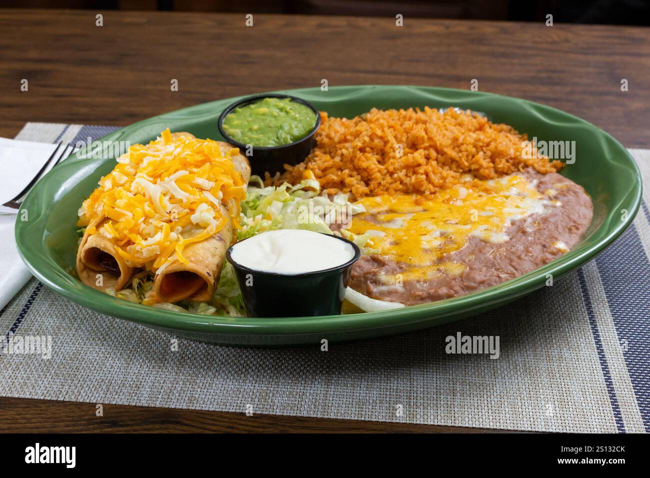 A view of a taquitos entree Stock Photo - Alamy