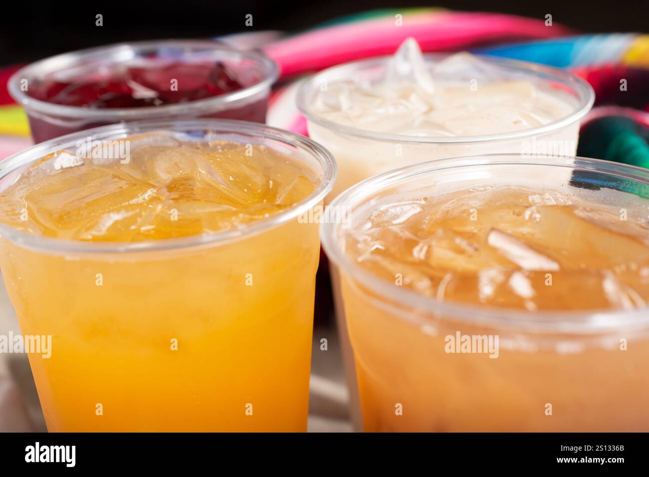 A closeup view of several varieties of aguas frescas Mexican fruit ...