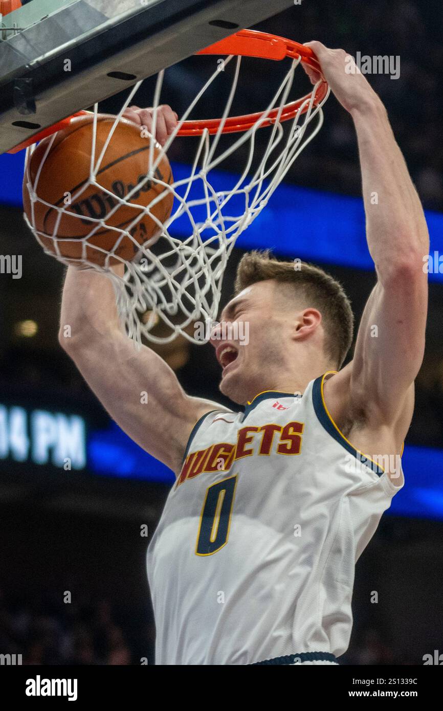 Denver Nuggets guard Christian Braun dunks during the first half of an ...