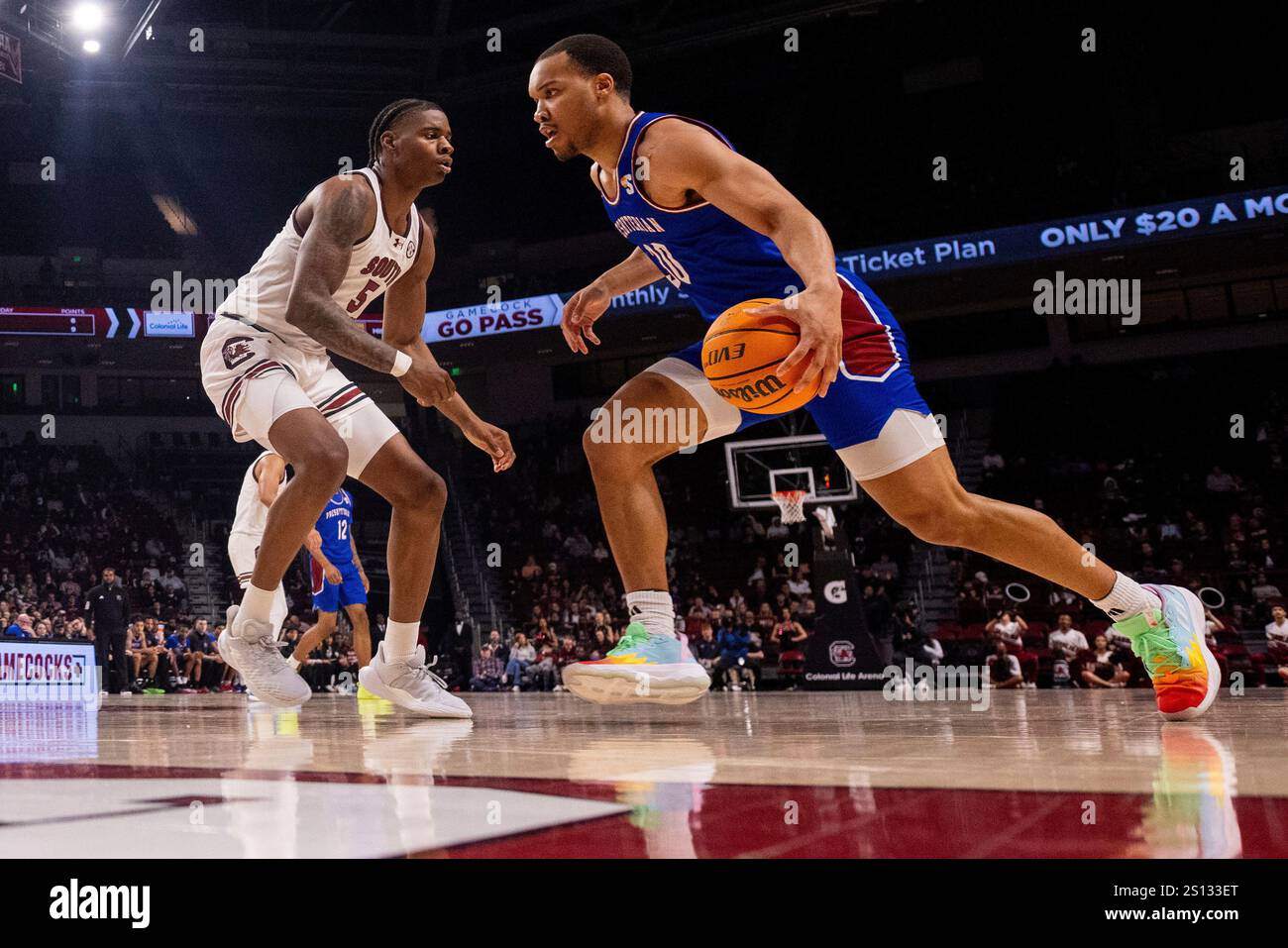 December 30, 2024: Presbyterian forward Kaleb Scott (30) drives on South Carolina forward Nick ...