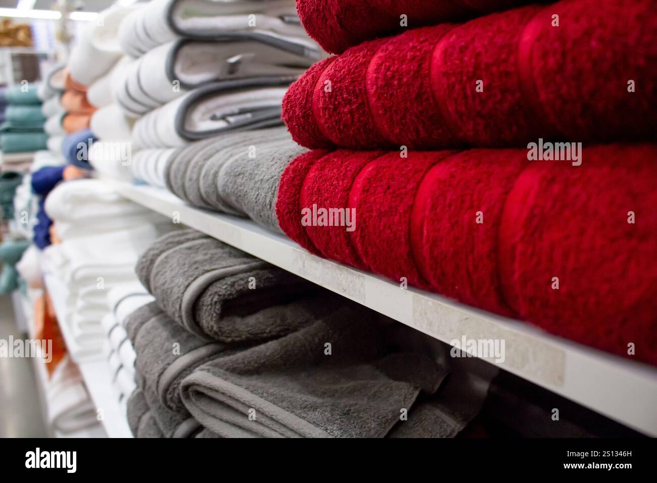 A view of stacks of towels on shelves at a department store using eye ...