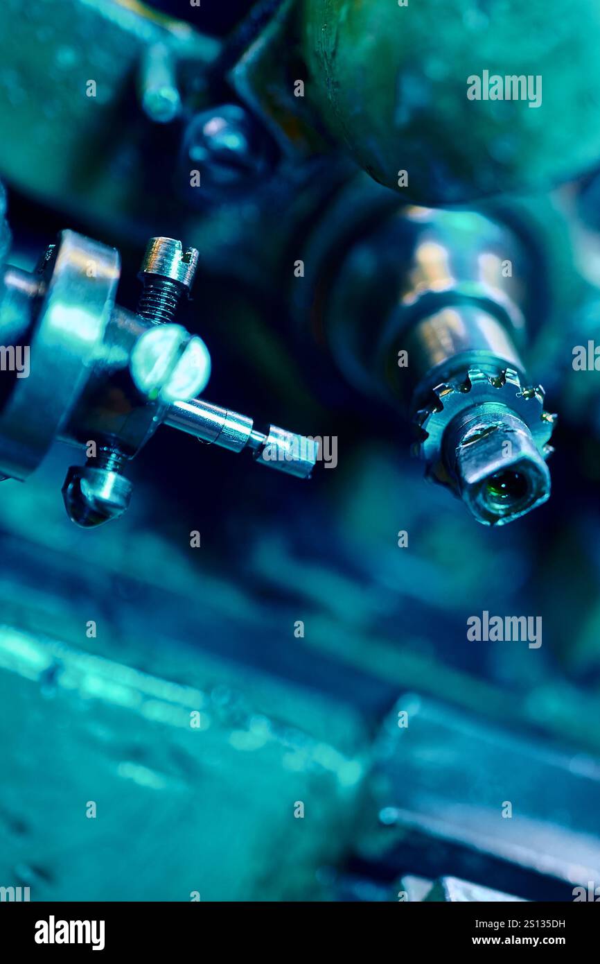 Precision milling machine at work crafting intricate clockwork pinion ...