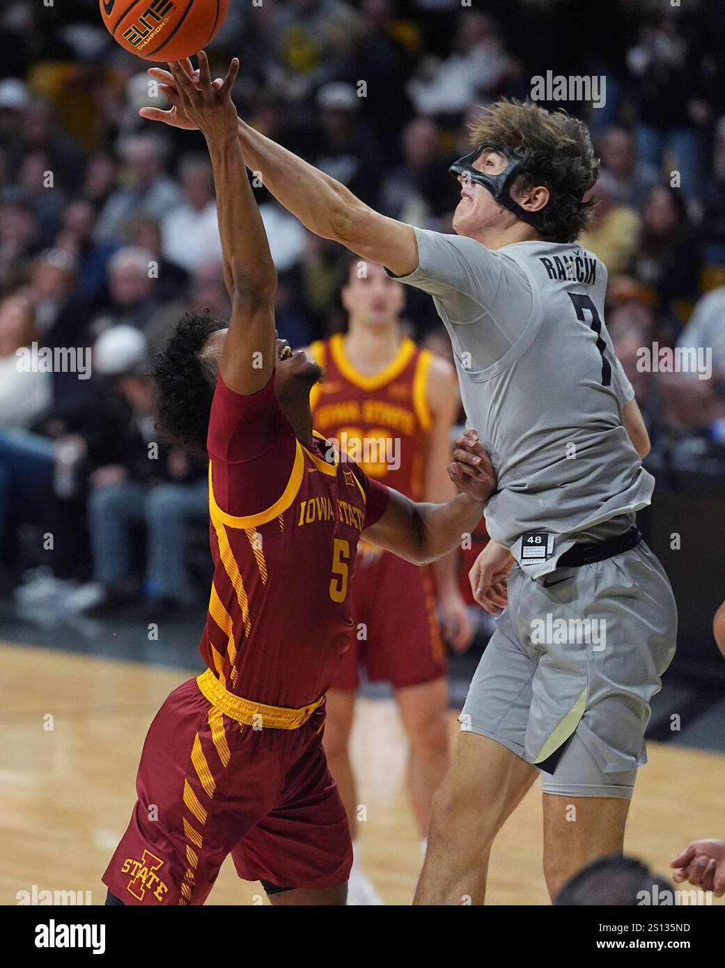 Colorado forward Sebastian Rancik, right, blocks a shot by Iowa State ...
