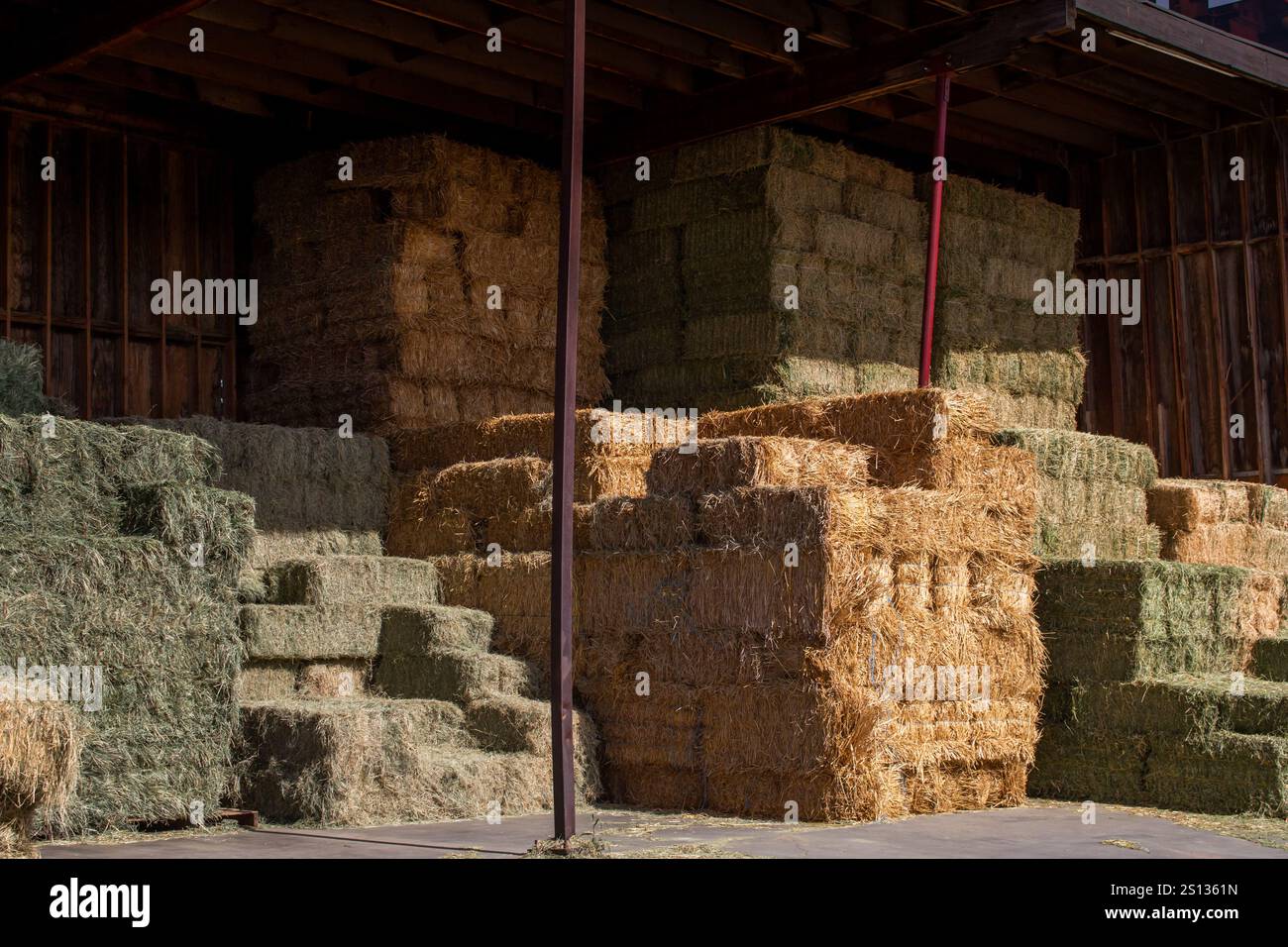A view of several varieties of hay stacks, seen at a local feed store ...