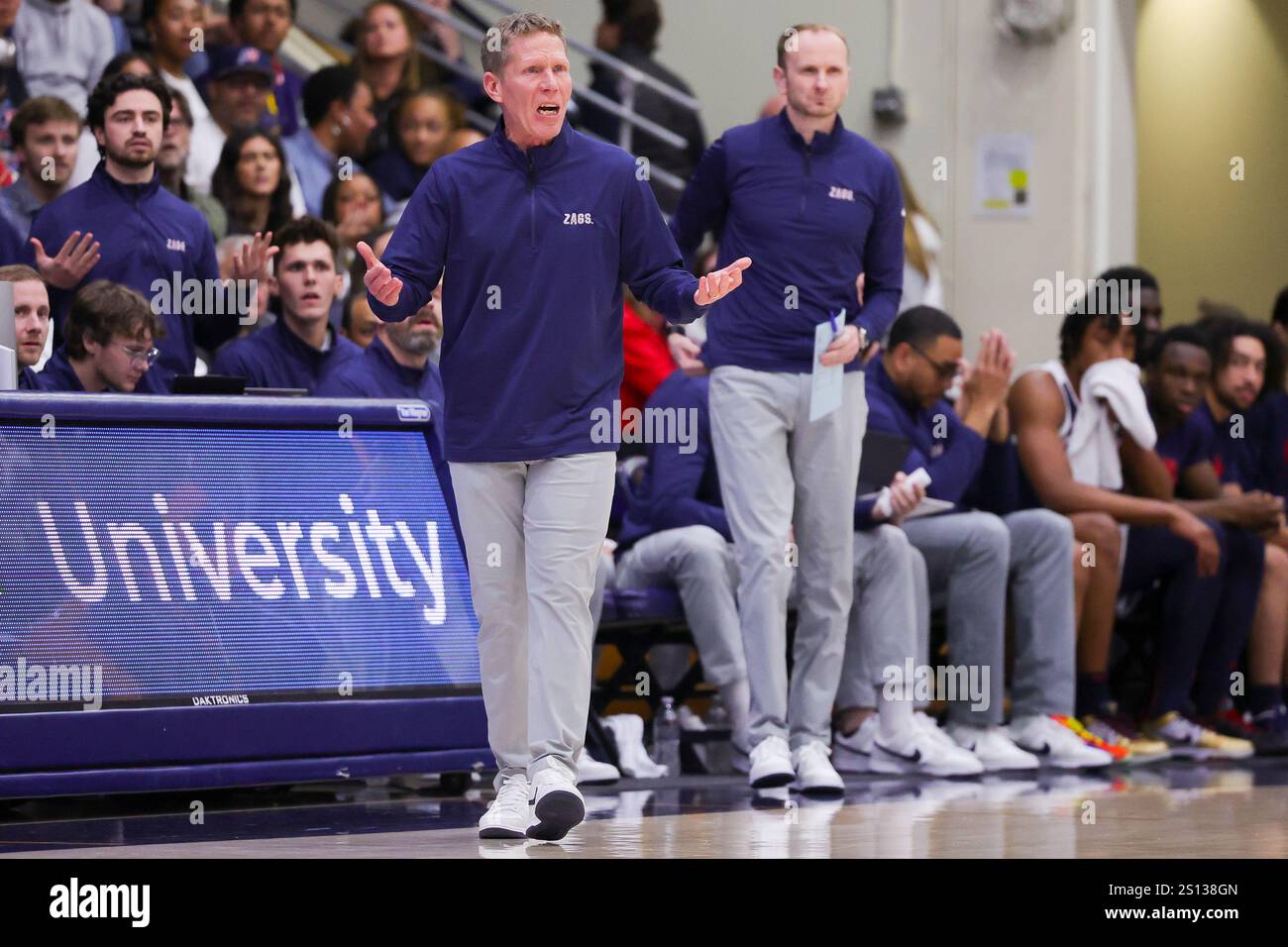 Gonzaga head coach Mark Few, left, reacts during the first half of an ...