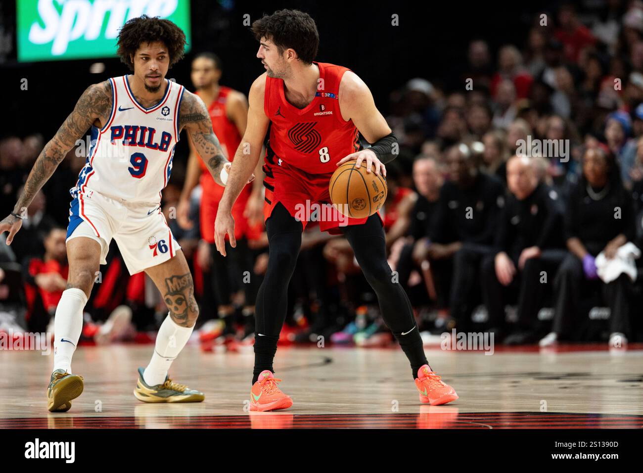 Portland Trail Blazers forward Deni Avdija, right, dribbles against ...