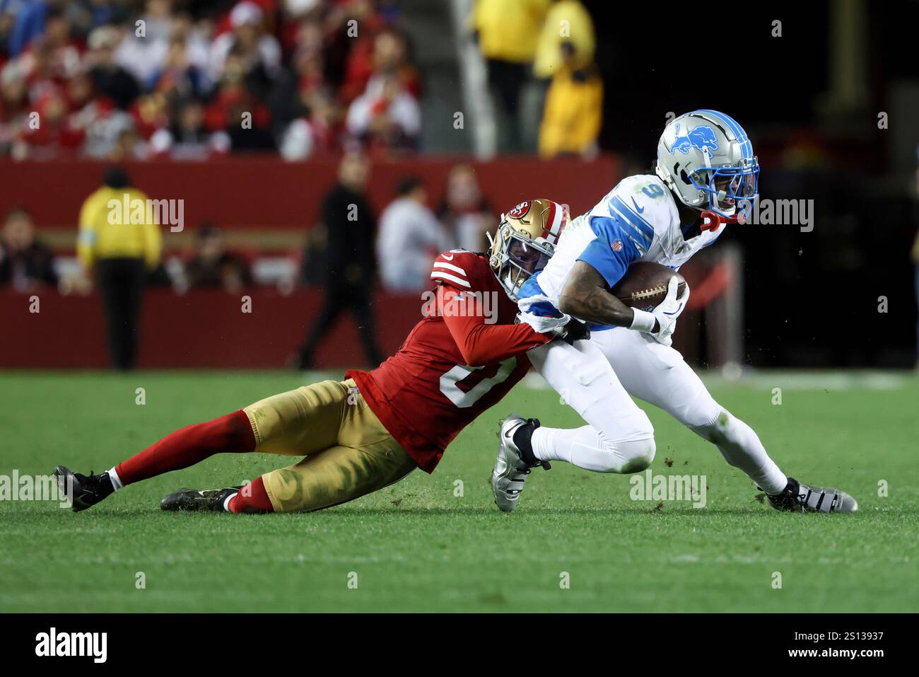 Detroit Lions wide receiver Jameson Williams (9) is tackled by San Francisco 49ers cornerback ...