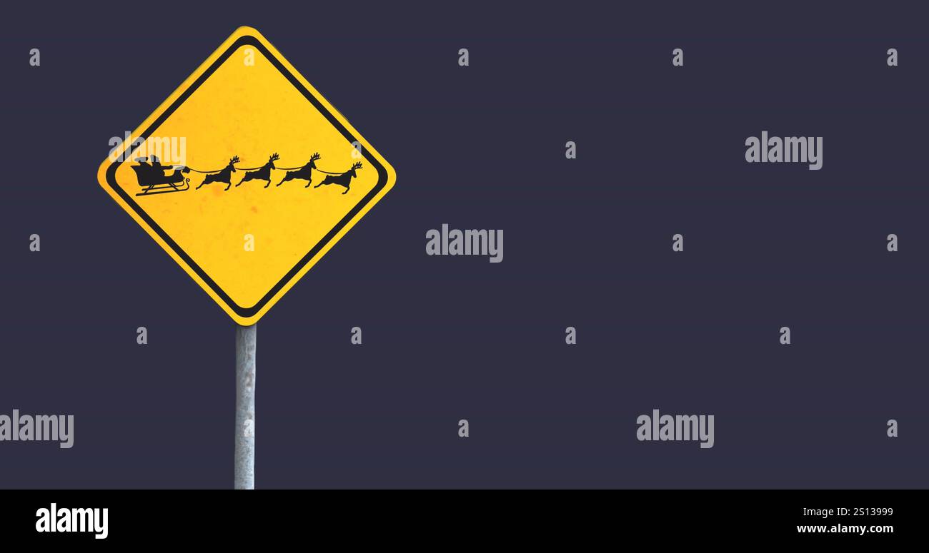 A yellow road sign warns of sled crossing ahead, with copy space. The ...