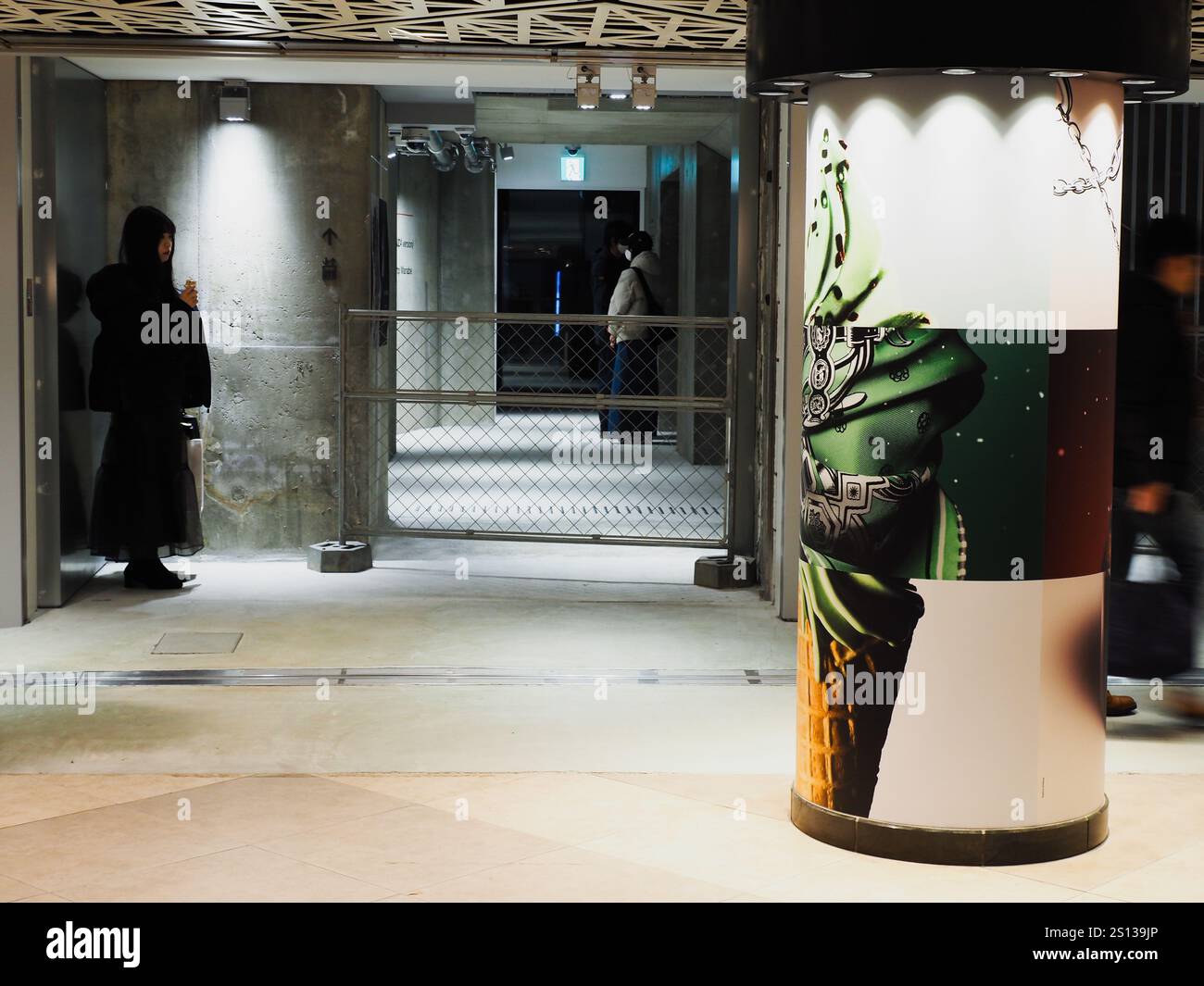 Underground concourse in Ginza with ad on a column for Hermes. Ginza Sony Park is in the ...