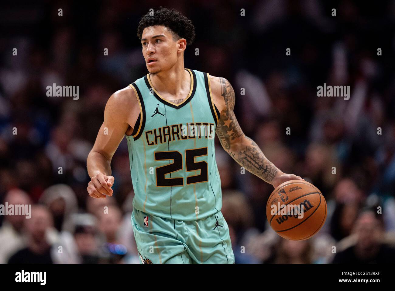 Charlotte Hornets guard KJ Simpson (25) brings the ball up court ...