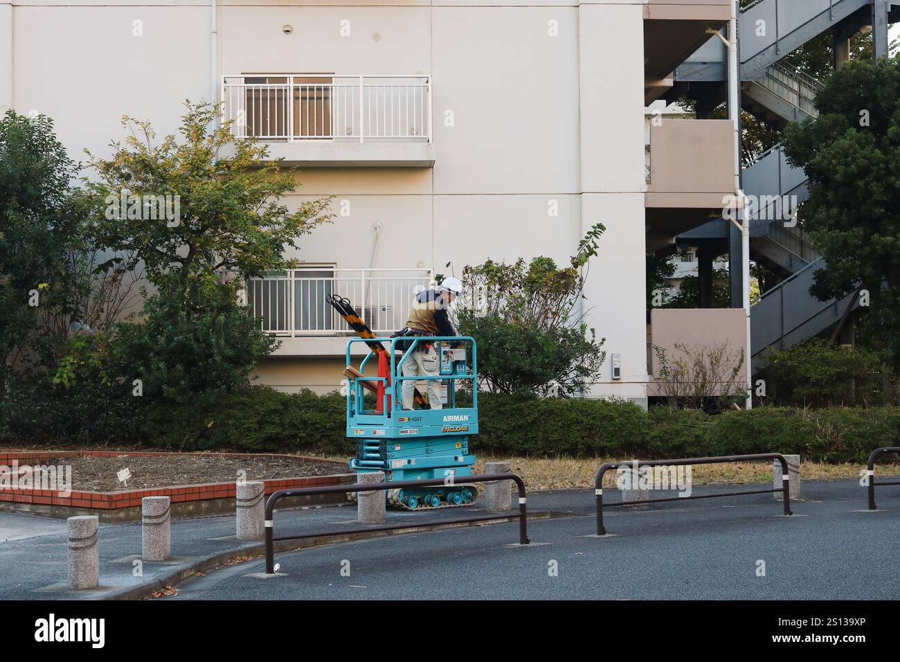 TOKYO, JAPAN - November 19, 2024: An aerial work platform being driven ...