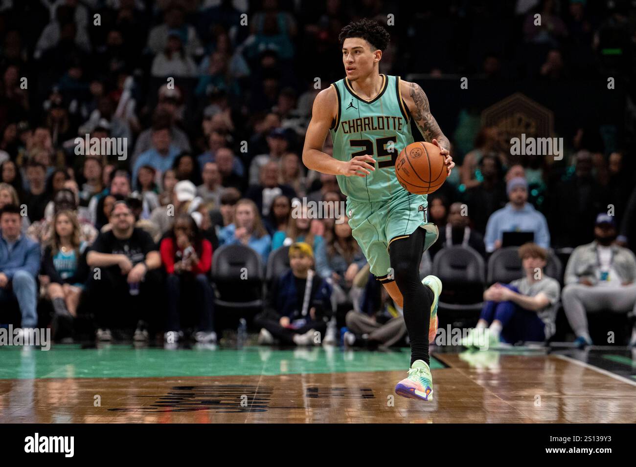 Charlotte Hornets guard KJ Simpson (25) brings the ball up court ...