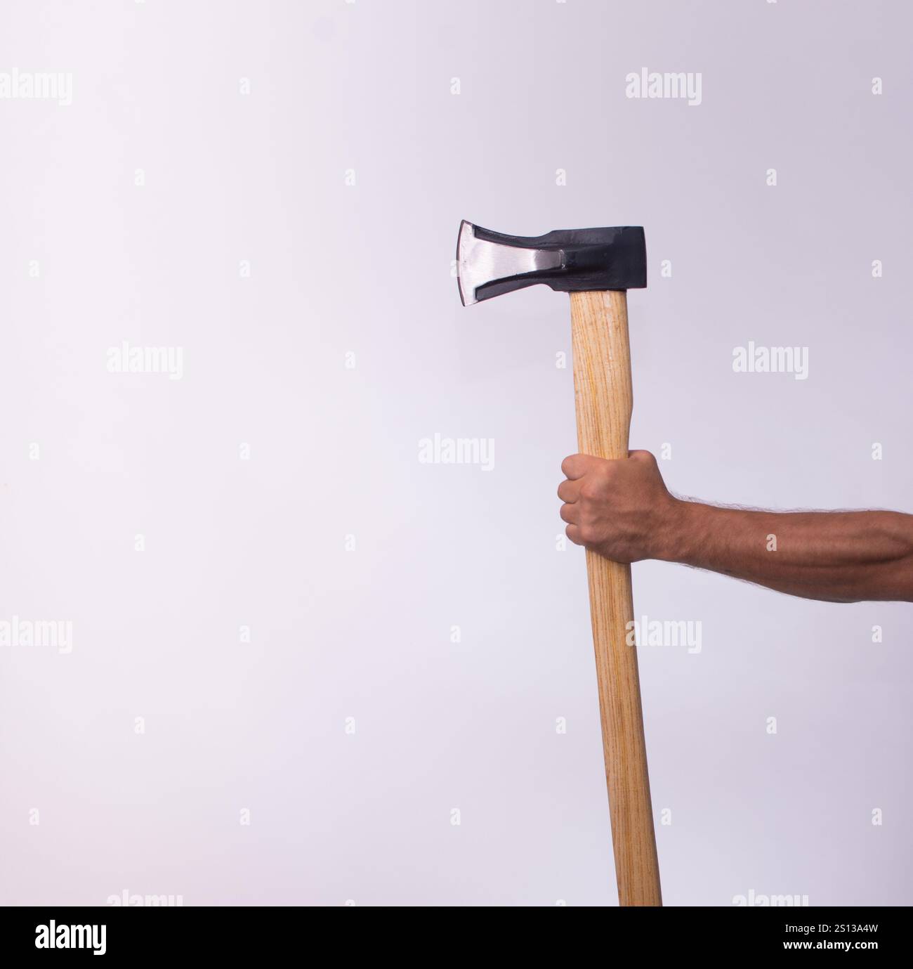 Wood chopping axe in hand on white background Stock Photo - Alamy
