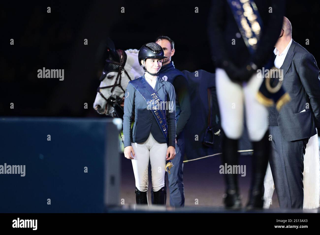 Laura Andre of Switzerland with Clementine during the prize giving ...
