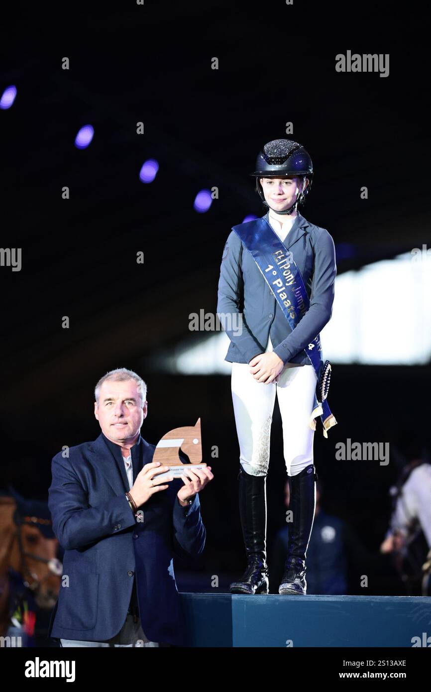 Laura Andre of Switzerland with Clementine during the prize giving ...