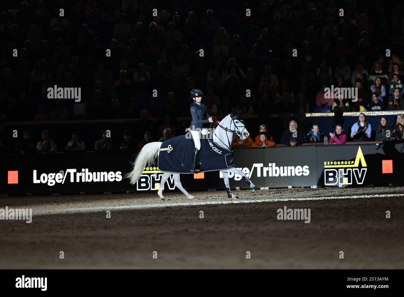 Laura Andre of Switzerland with Clementine during the prize giving ...