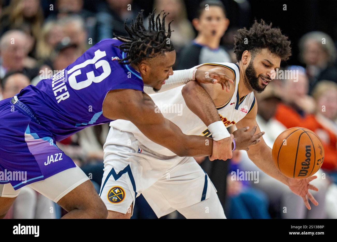Utah Jazz guard Isaiah Collier (13) knocks the ball away from Denver ...