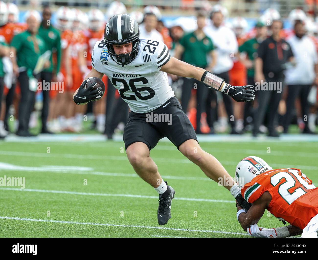 Orlando, FL, USA. 28th Dec, 2024. Iowa State's Carson Hansen (26) tries ...