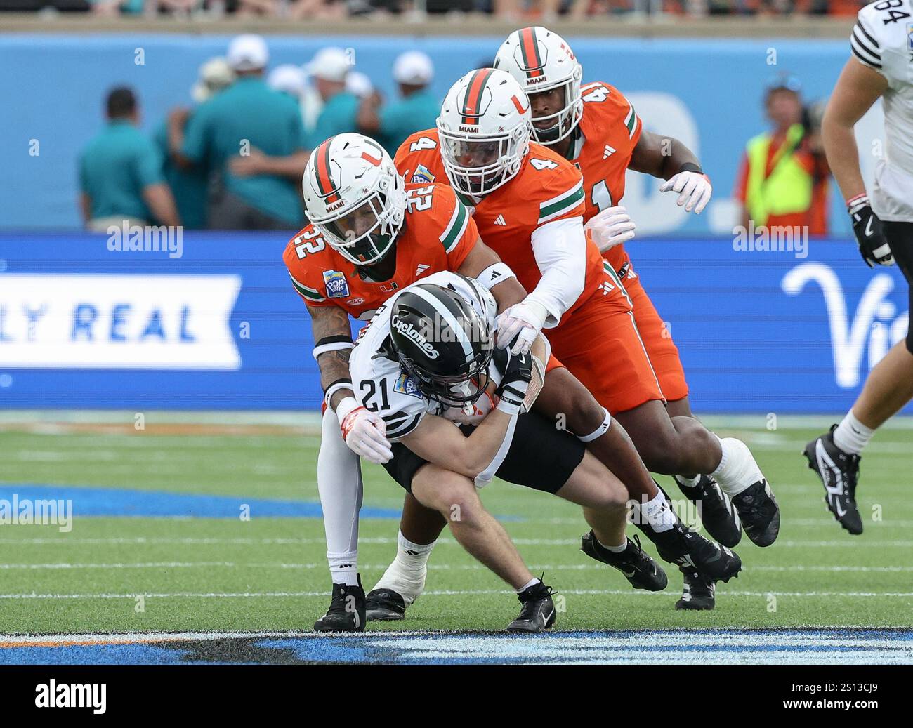 Orlando, FL, USA. 28th Dec, 2024. Miami's Cam Pruitt (22) tackles the ...