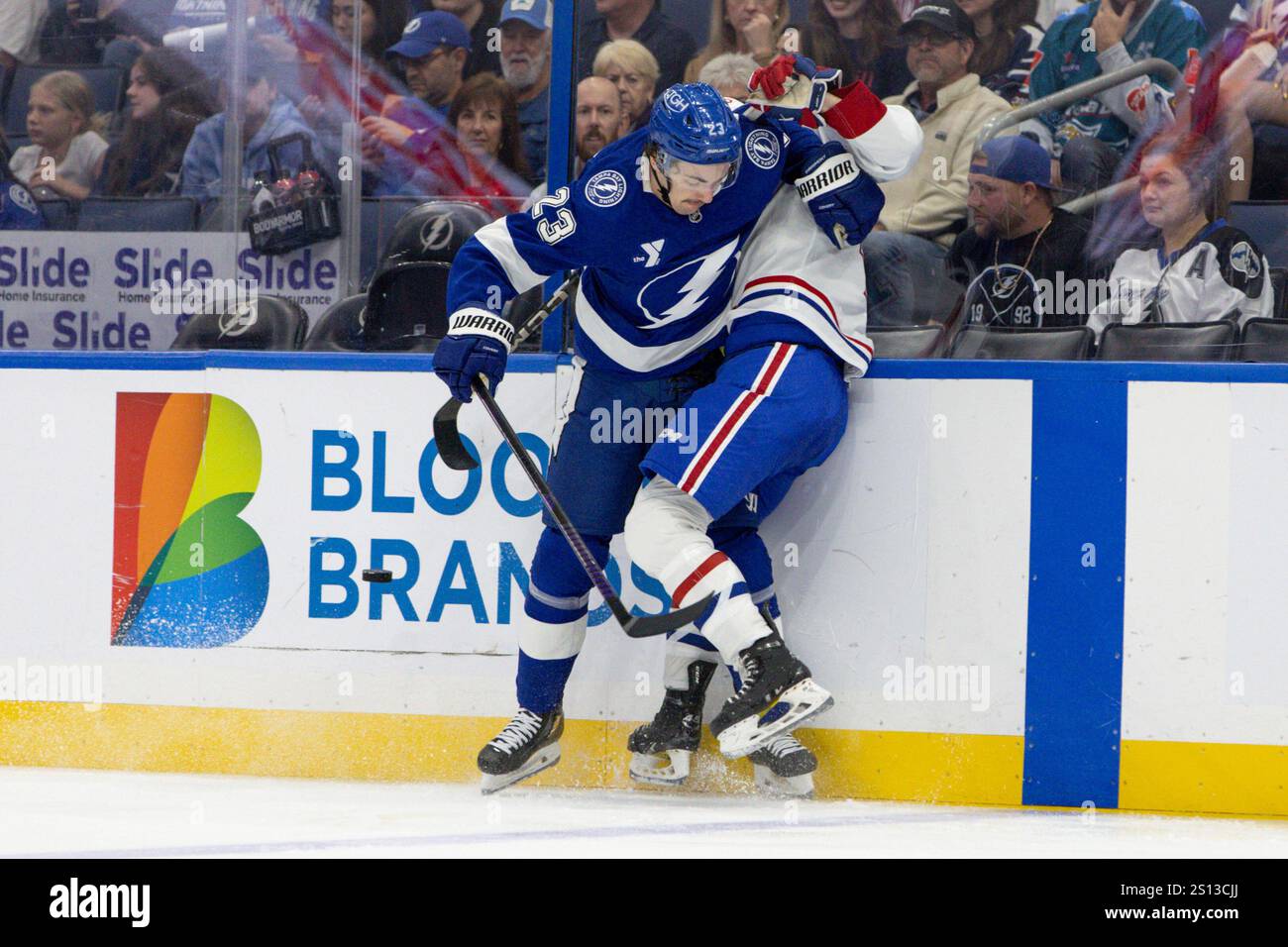 Tampa Bay Lightning center Michael Eyssimont (23) checks a member of ...