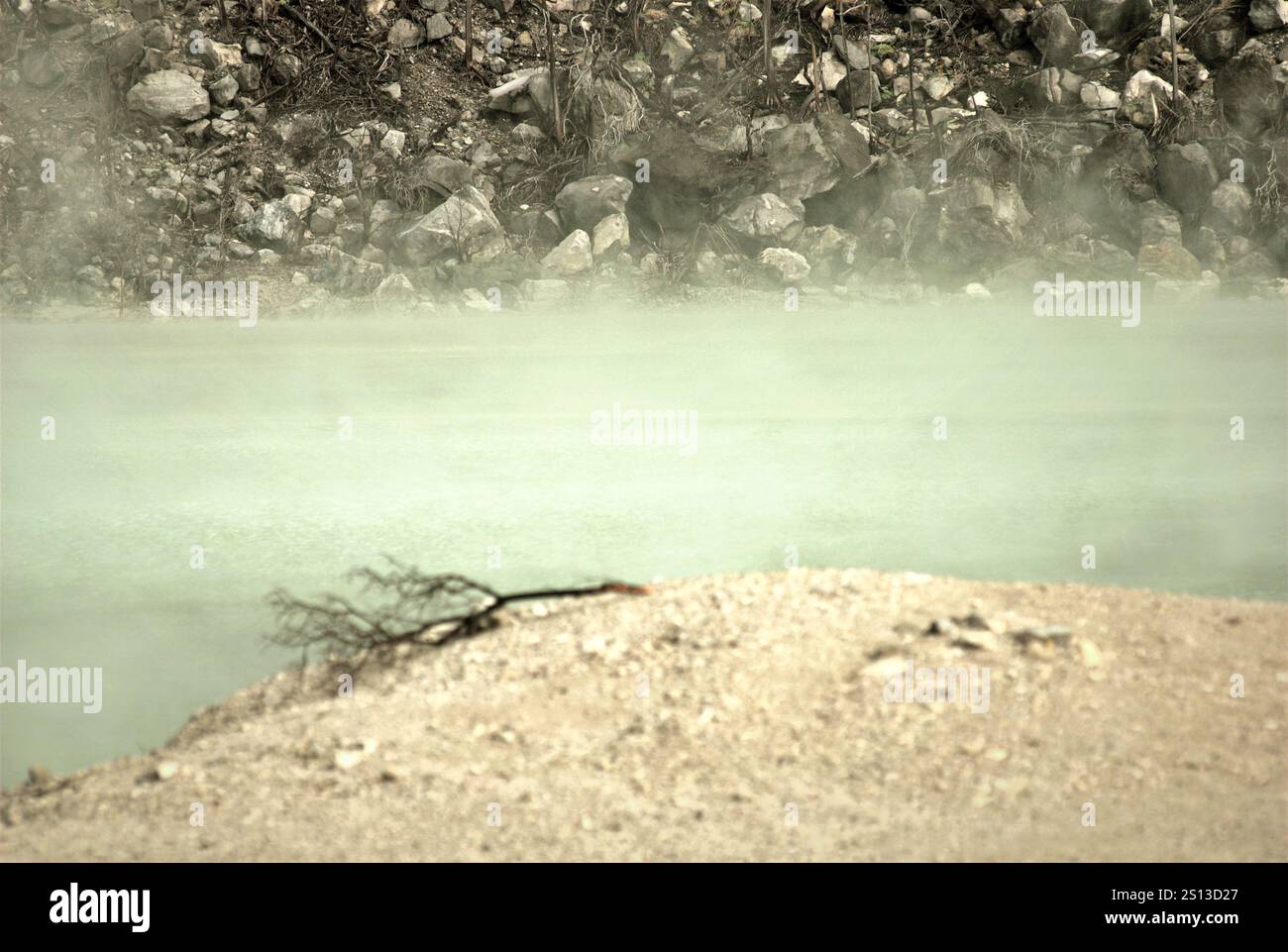 Details of crater wall in a foreground of crater lake and a dead ...