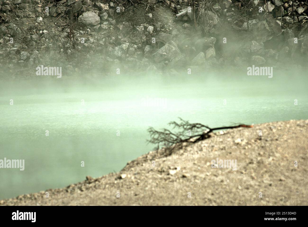 Details of crater wall in a foreground of crater lake and a dead ...