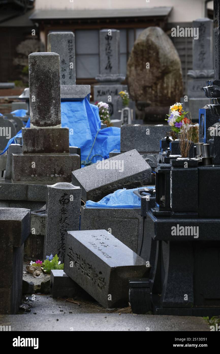 Gravestones remain broken in Wajima, Ishikawa Prefecture, on Dec. 24 ...
