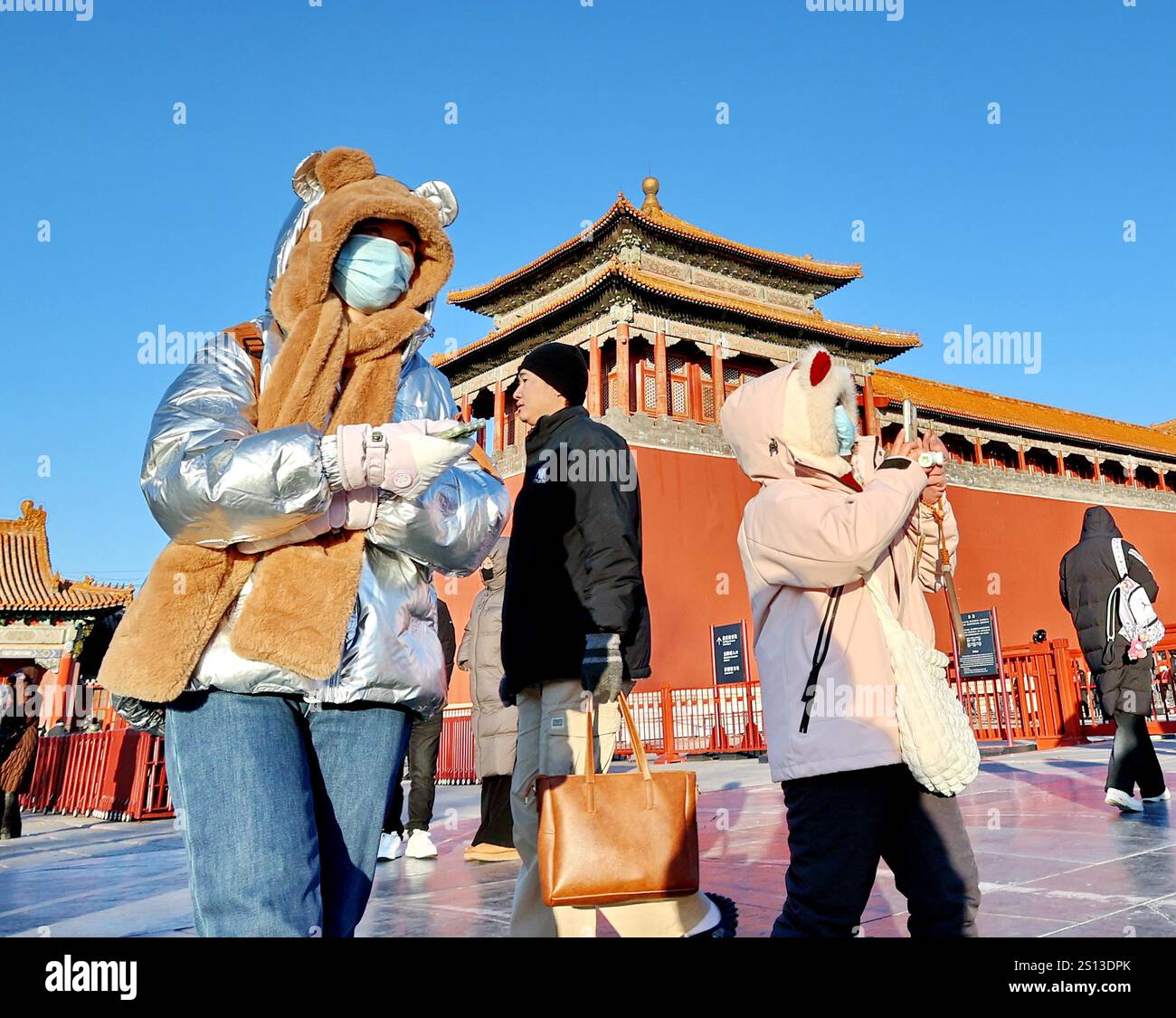 Tourists visit the Palace Museum amid cold air in Beijing, China, 27 ...