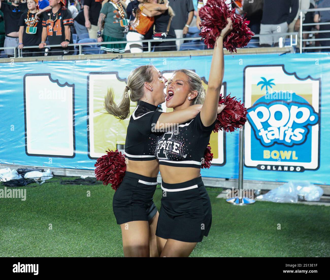 Orlando, FL, USA. 28th Dec, 2024. Iowa State Dance Team members ...