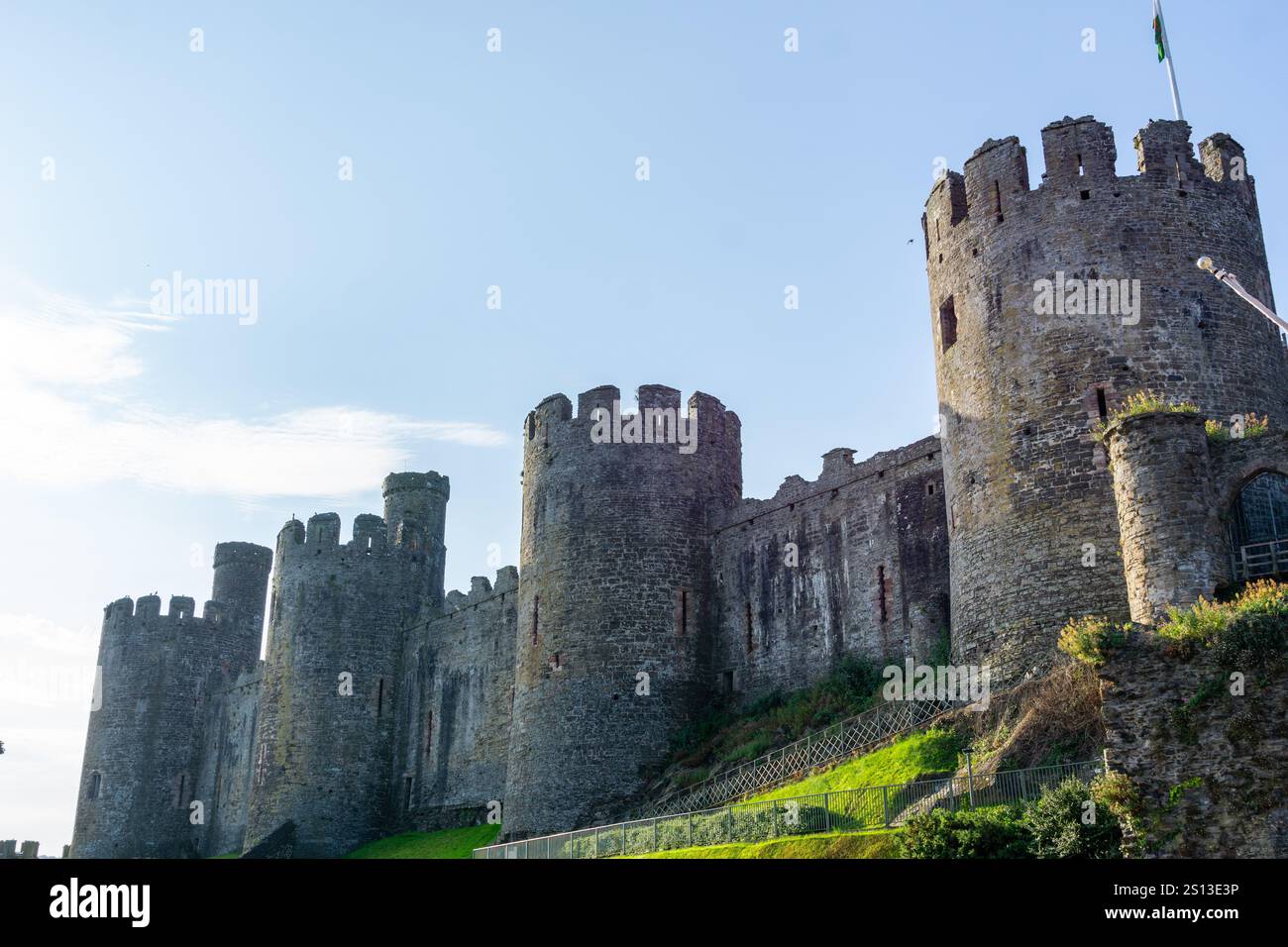 Outside stone fortifications of historic Conwy Castle with it's towers ...